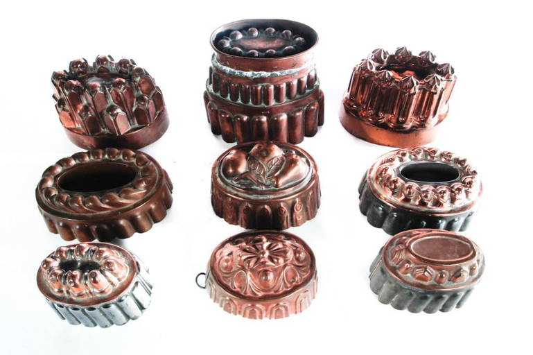 Nine Copper Food Molds.