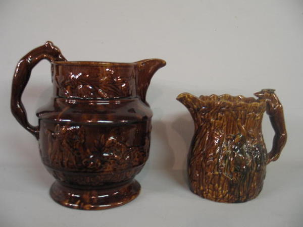 Two Rockingham Hound Handle Pitchers. Pictured One