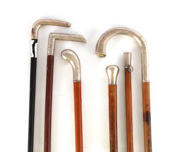 A Collection Of Three Silver Topped Walking Canes