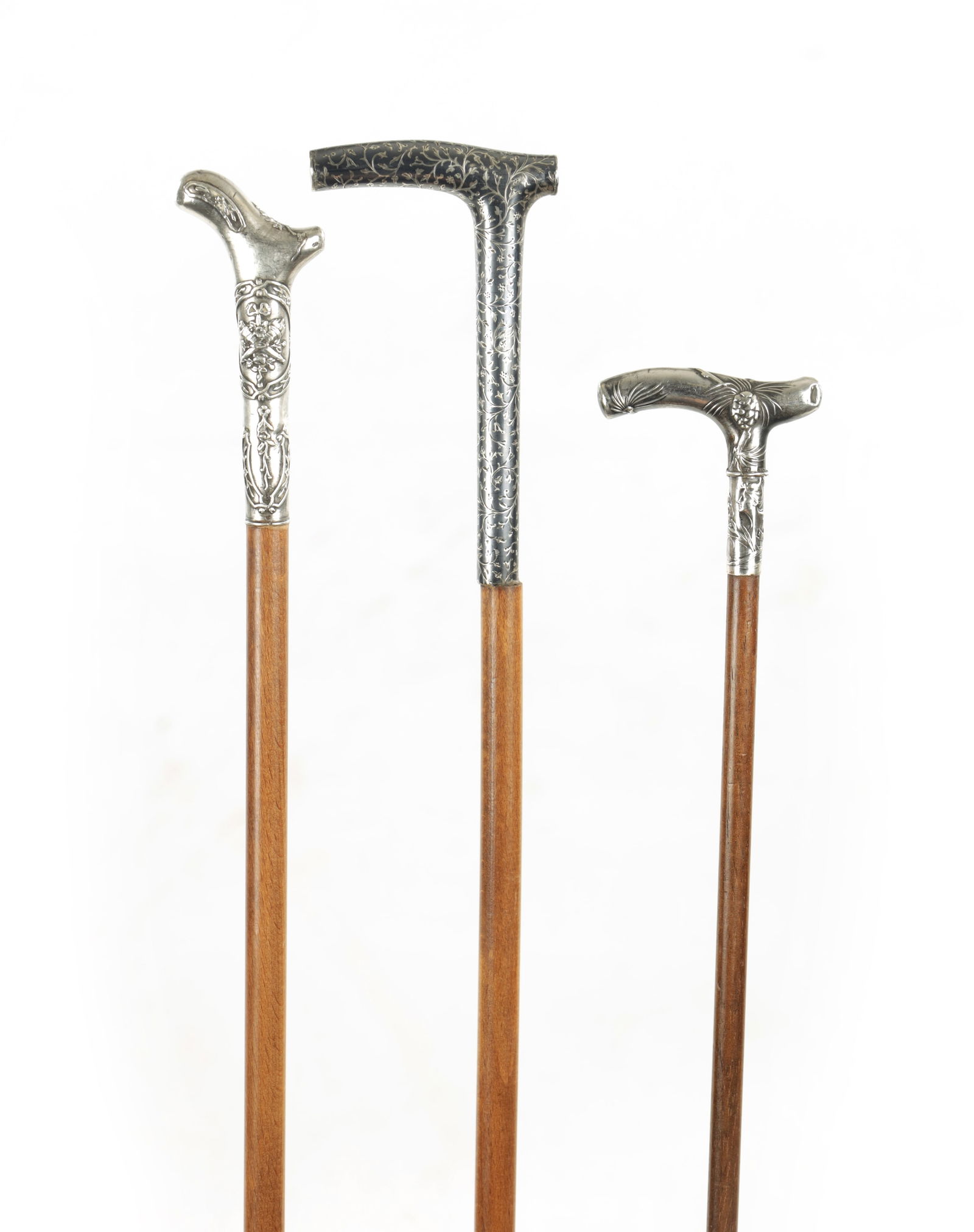 A Collection Of Three Small 19th Century Silver Topped Walking Sticks