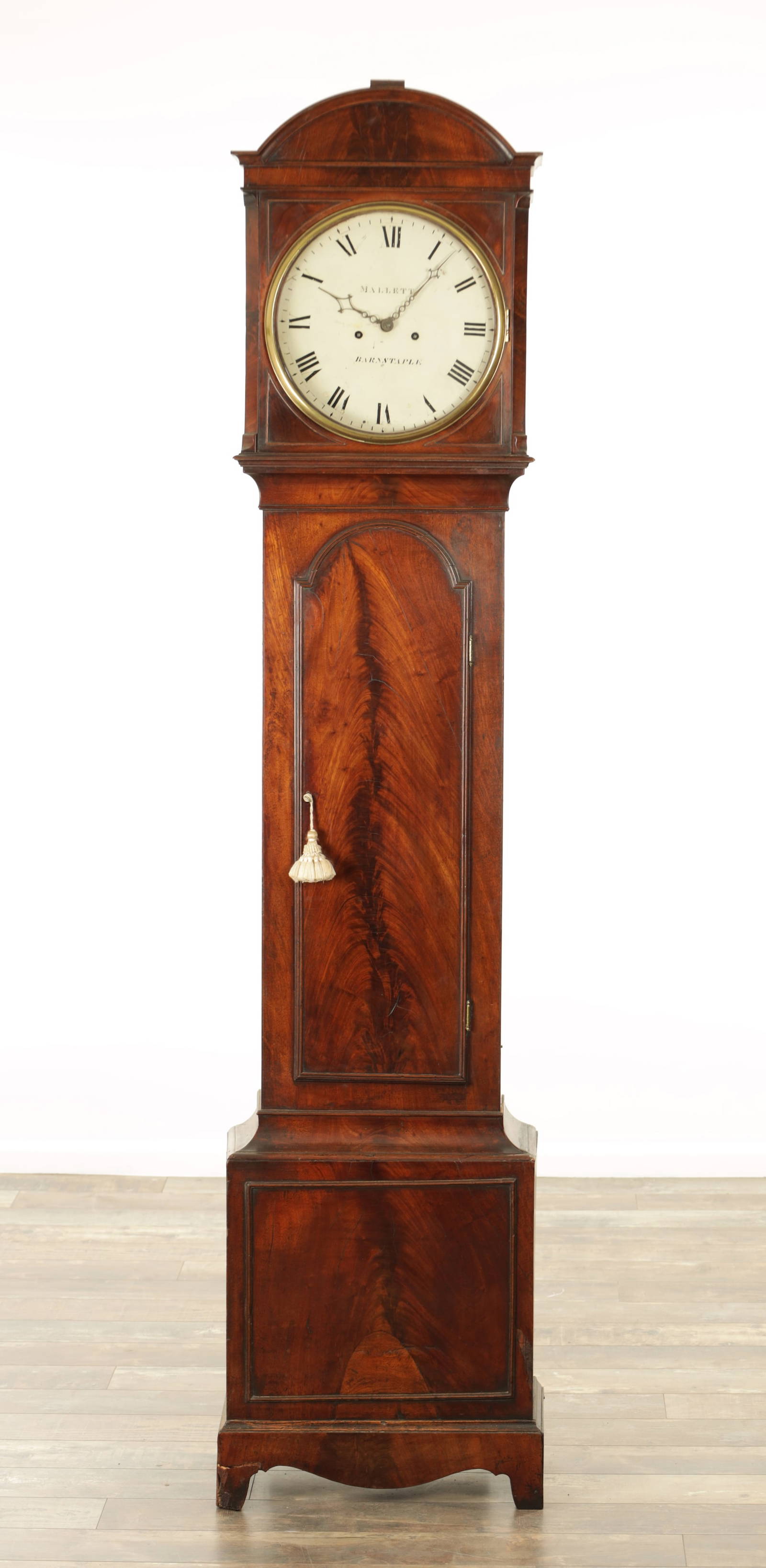 Mallett, Barnstaple. A Regency Figured Mahogany Longcase Clock Auction