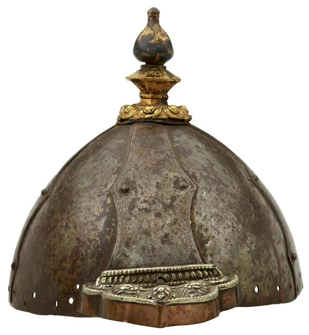 A 16TH or 17TH CENTURY TIBETAN HELMET, the eight piece skull formed of ...