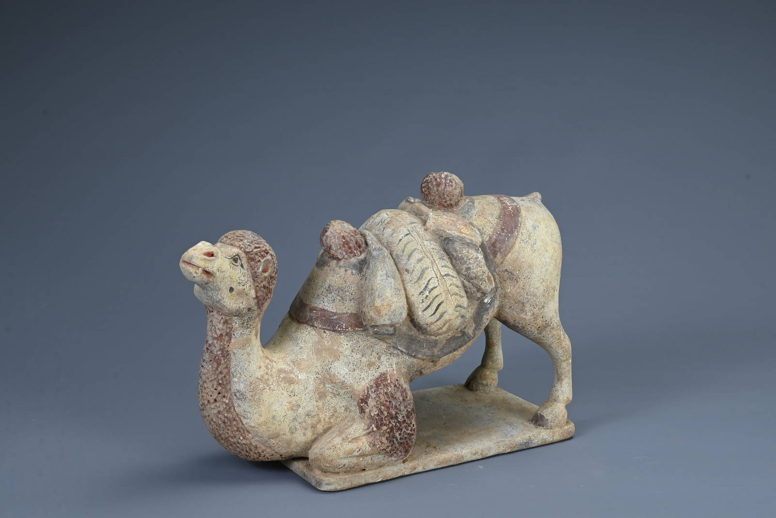 A Chinese Painted Pottery Figure Of A Kneeling Bactrian Camel, Probably ...