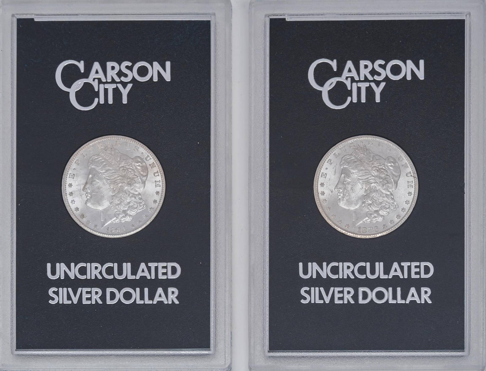 (2) Carson City Uncirculated Silver Dollars Auction