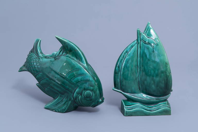 Lejan: A Figure Of A Fish And A Boat In Green And