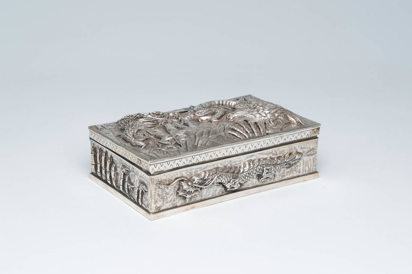 A Japanese Silver Box And Cover With Relief Design Of Dragons And An ...