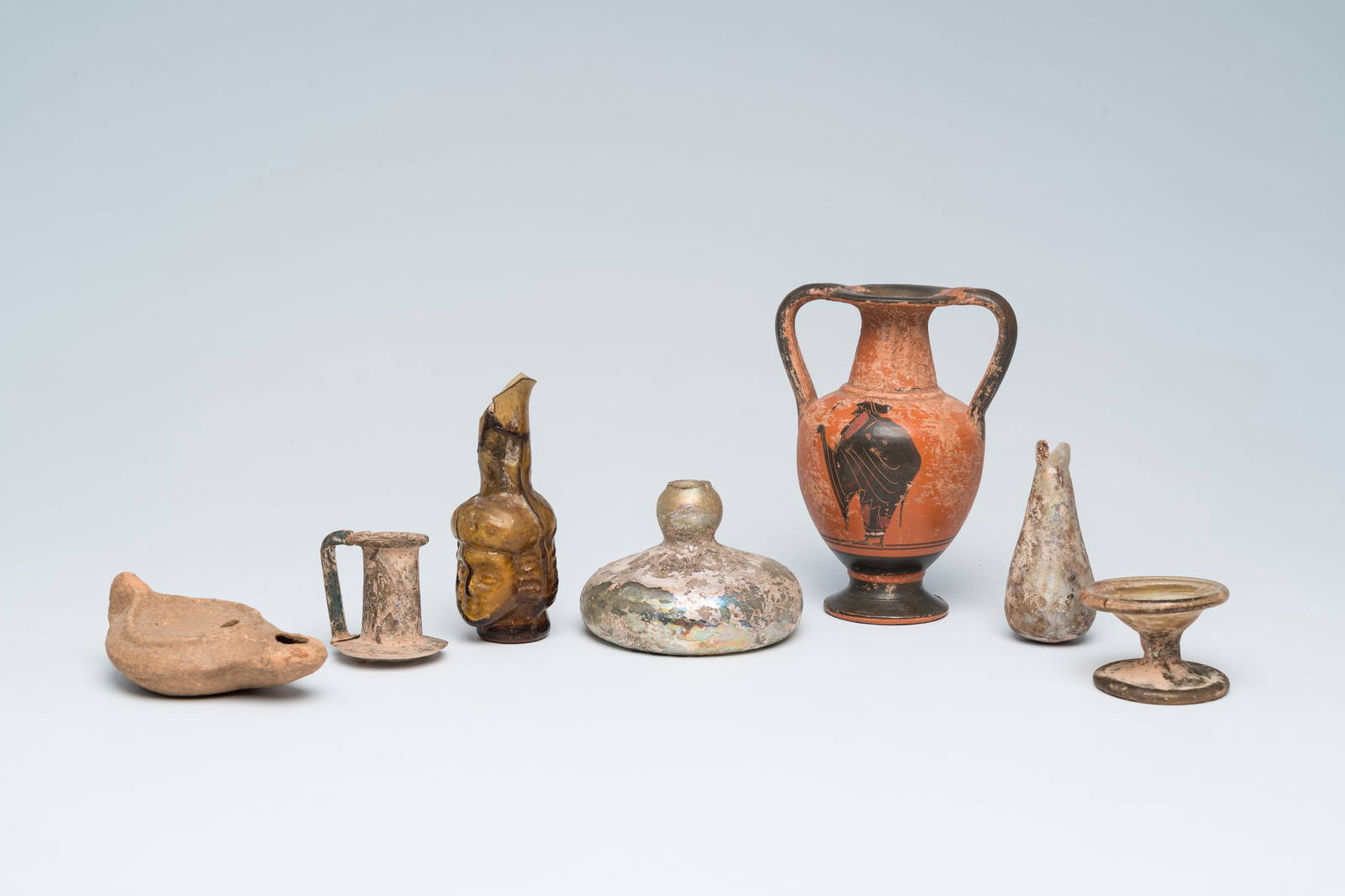 A Varied Collection Of Archaeological Glass And Pottery Utensils And ...