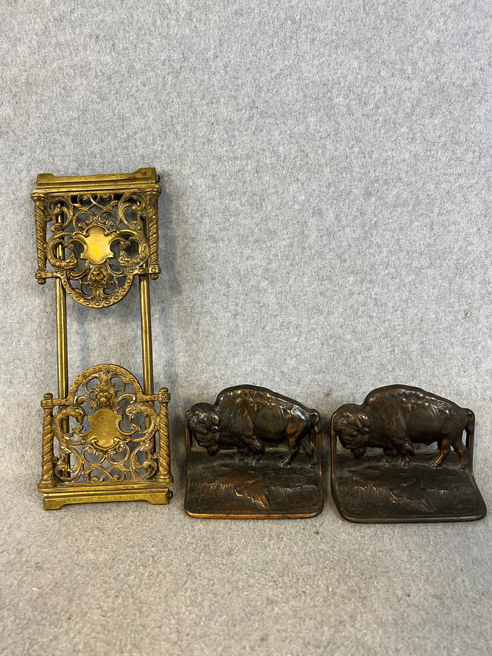 Brass Book Rack & Buffalo Theme Bookends Auction