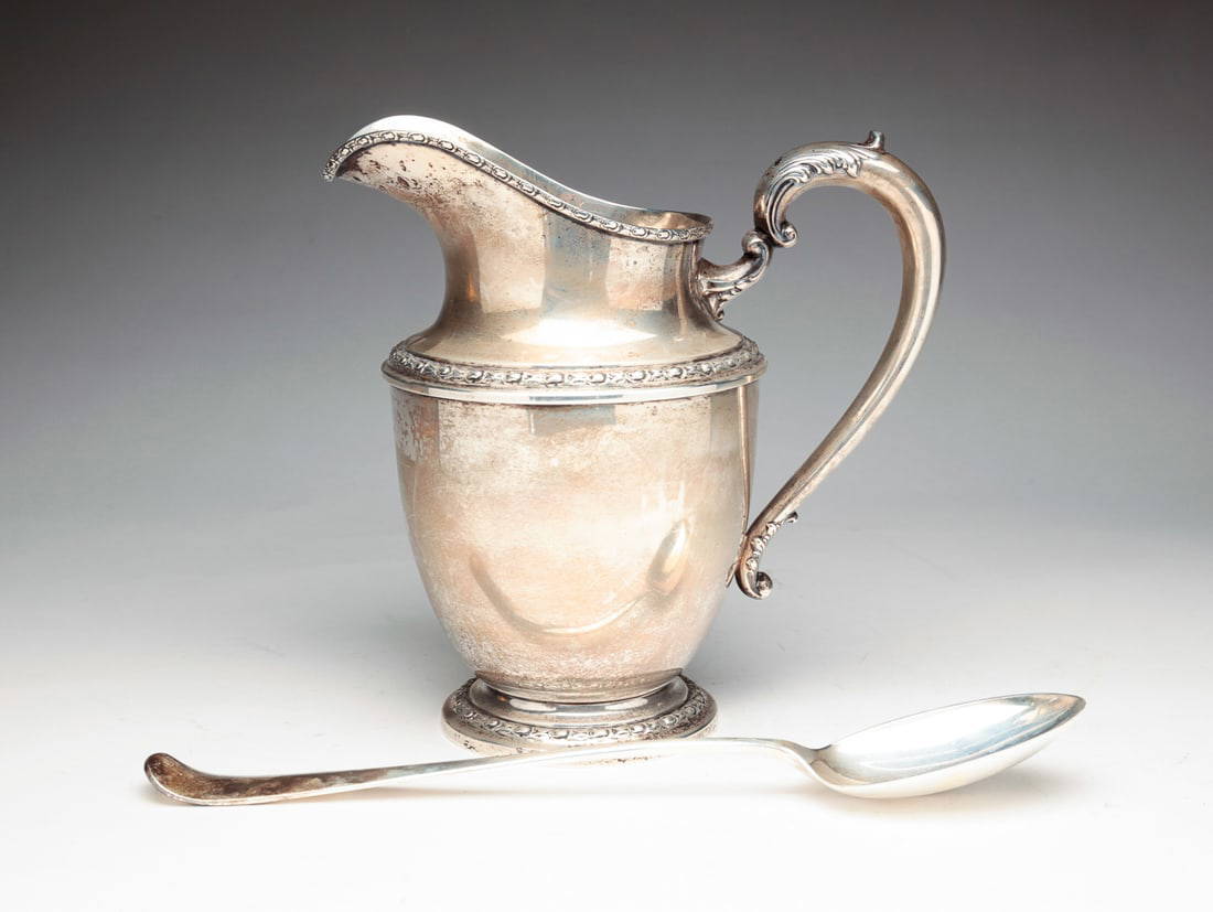 Sterling Silver Pitcher And Stuffing Spoon. Auction