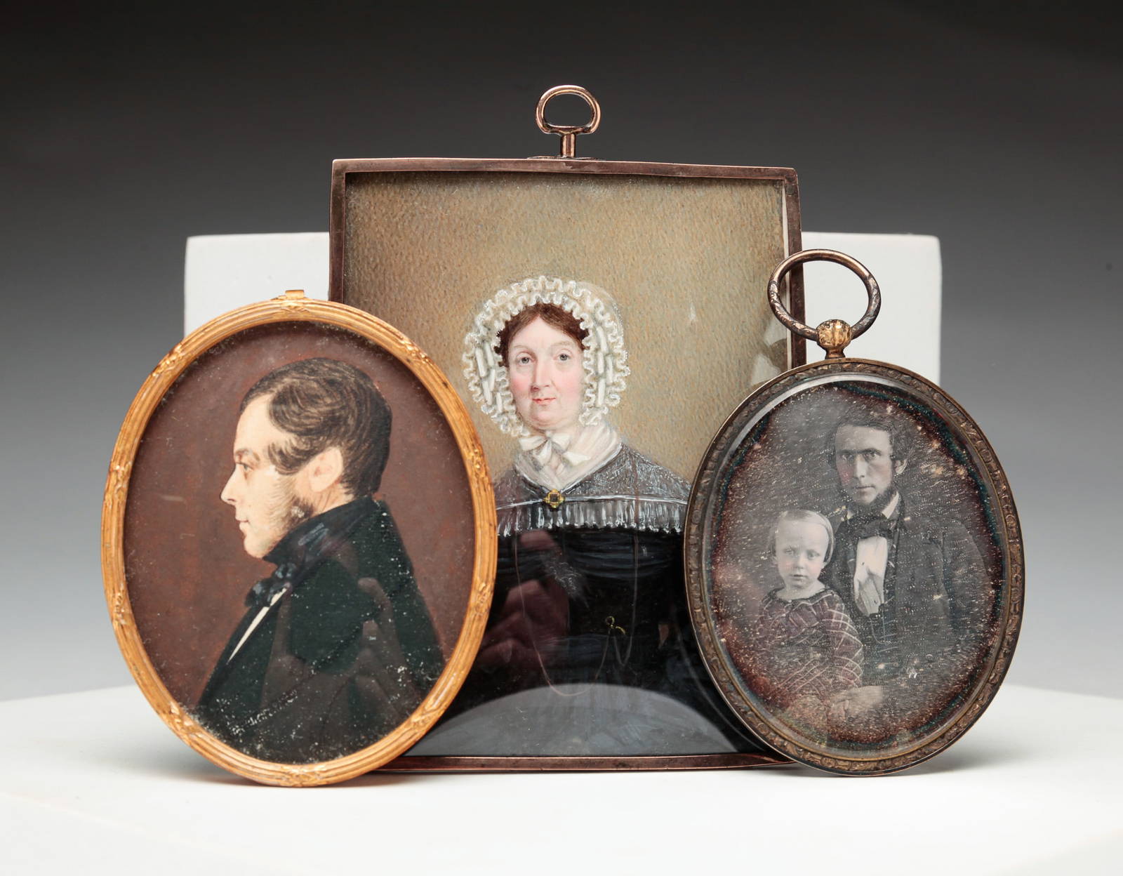 Three Portrait Lockets. Auction