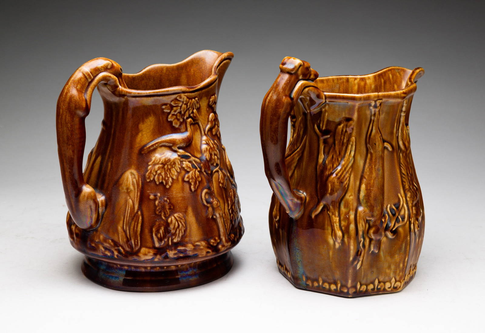 Two Hound Handled Yellowware Pitchers. Auction