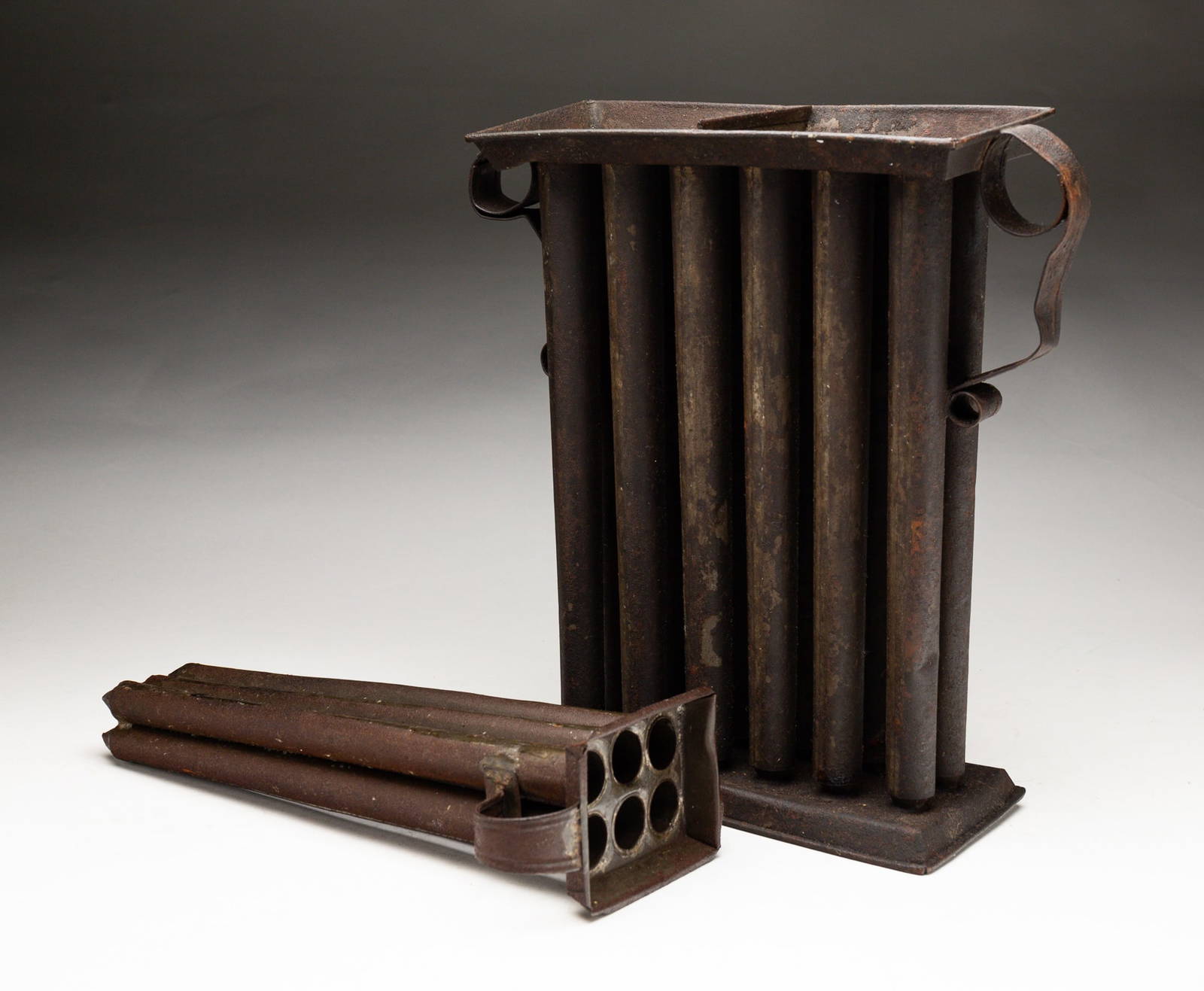 Two Tin Candle Molds. Auction
