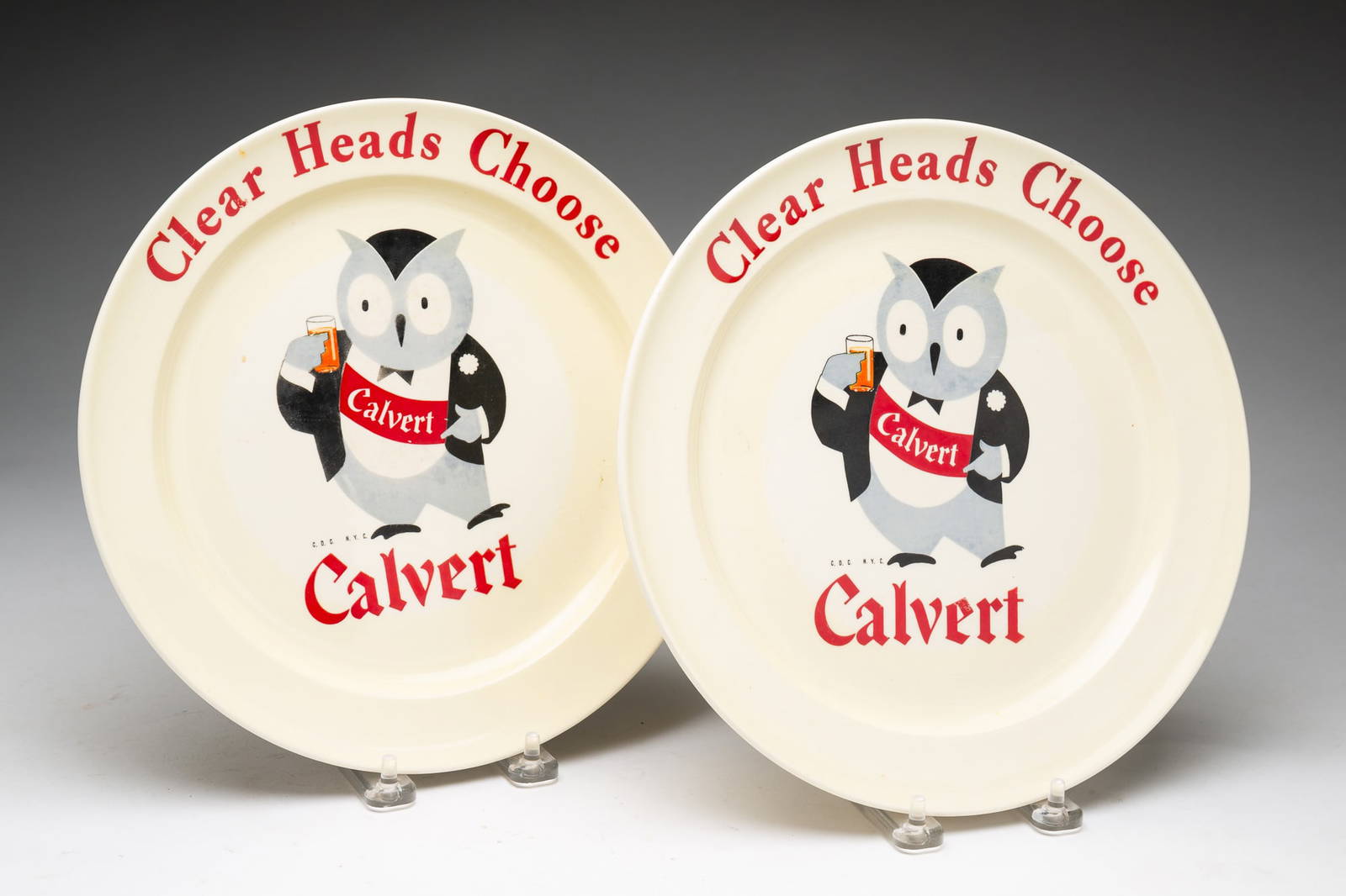 Two Advertising Plates. Auction