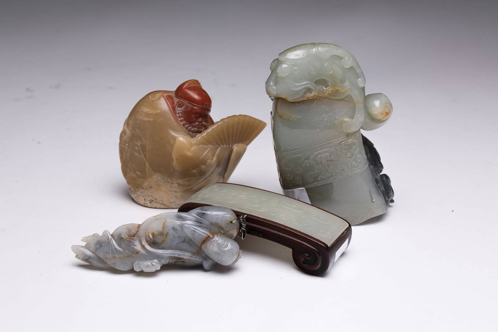 Four Jade/hard Stone Items. Auction