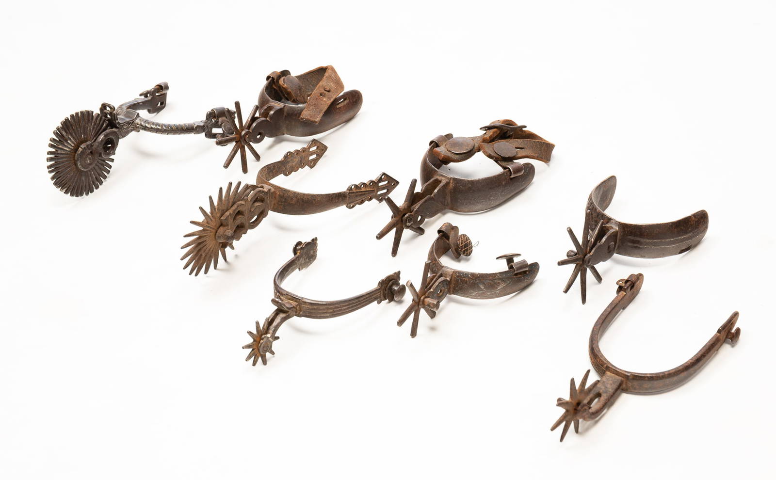 A Selection Of Eight American Forged Iron Spurs. Auction