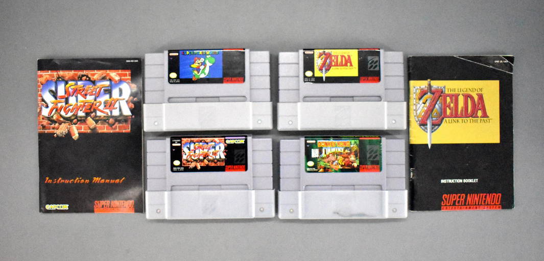 Four Snes Super Nintendo Cartridges With Two Manuals