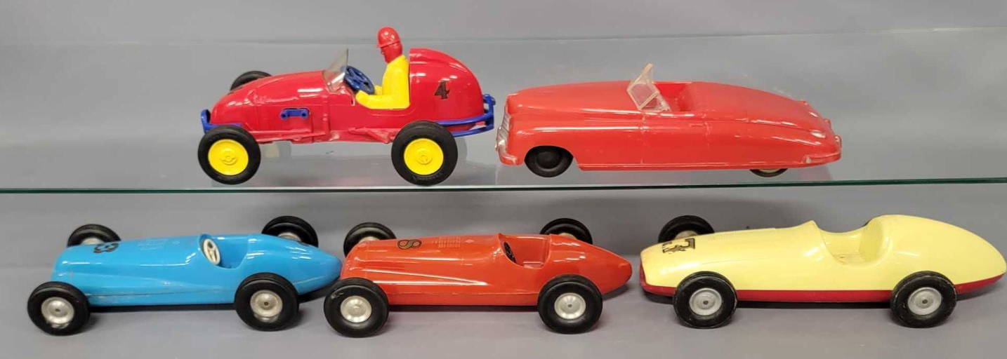 Five Vintage Plastic Wind Up Race Cars