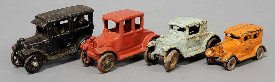 Four Arcade Cast Iron Cars