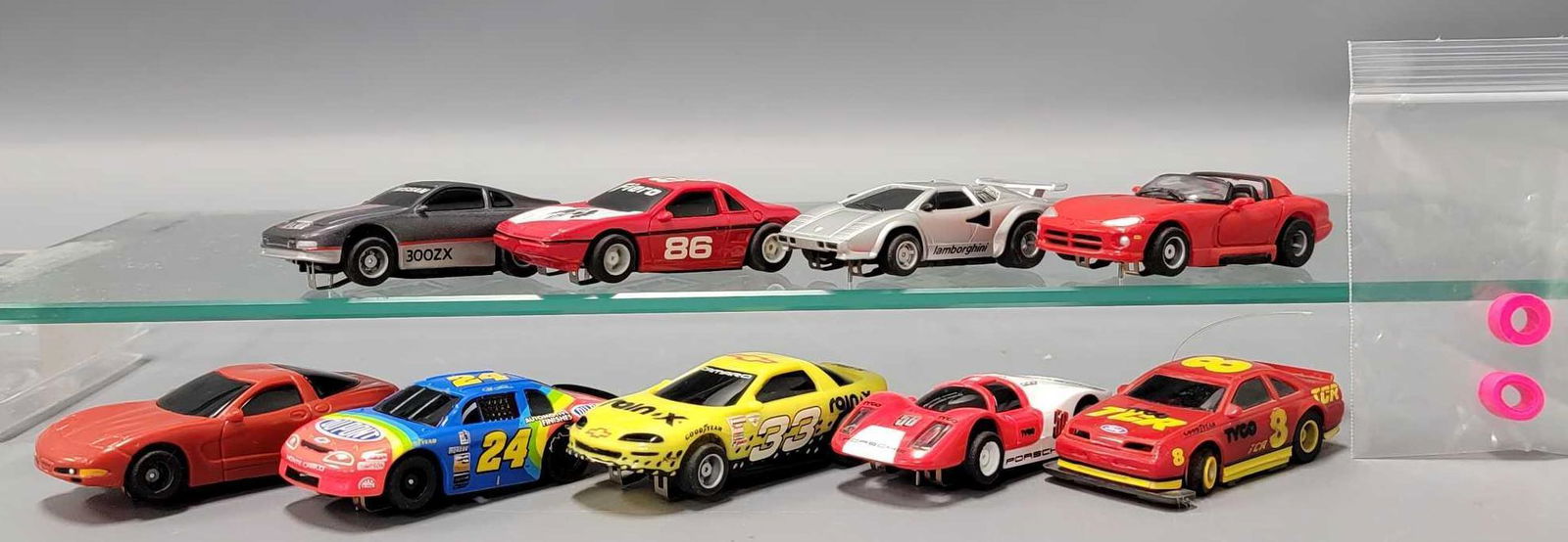 Nine Tyco And Afx Ho Slot Cars In A Clear Carrying Case