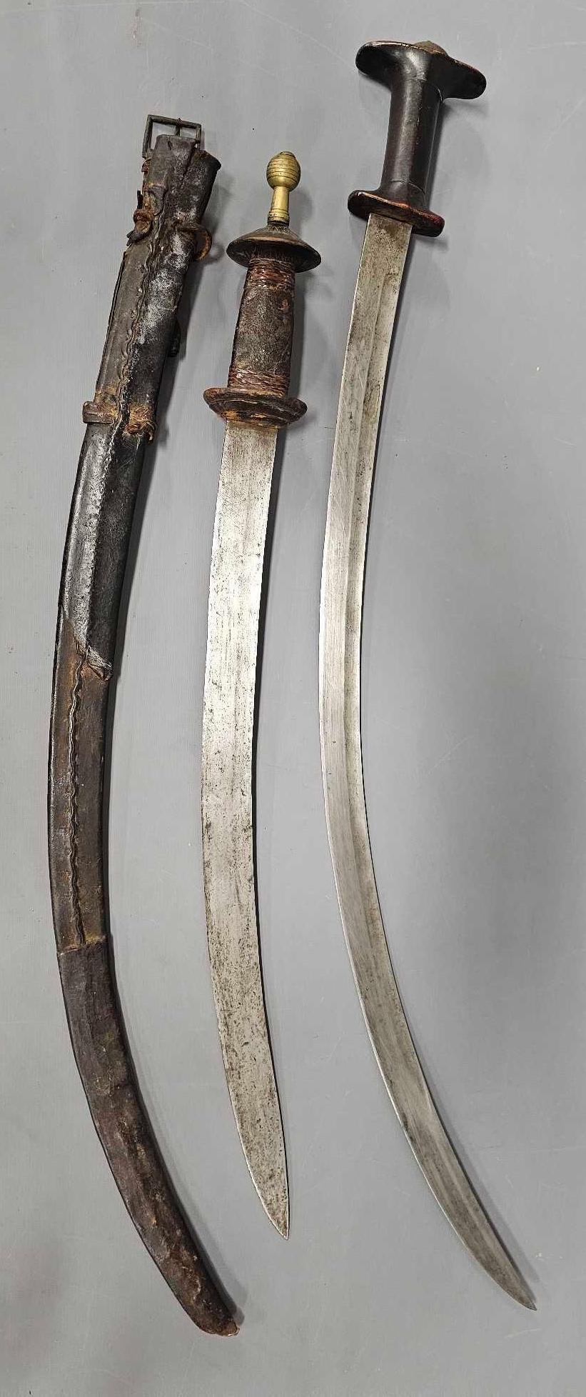 Two Arab Swords With One Leather Scabbard Auction