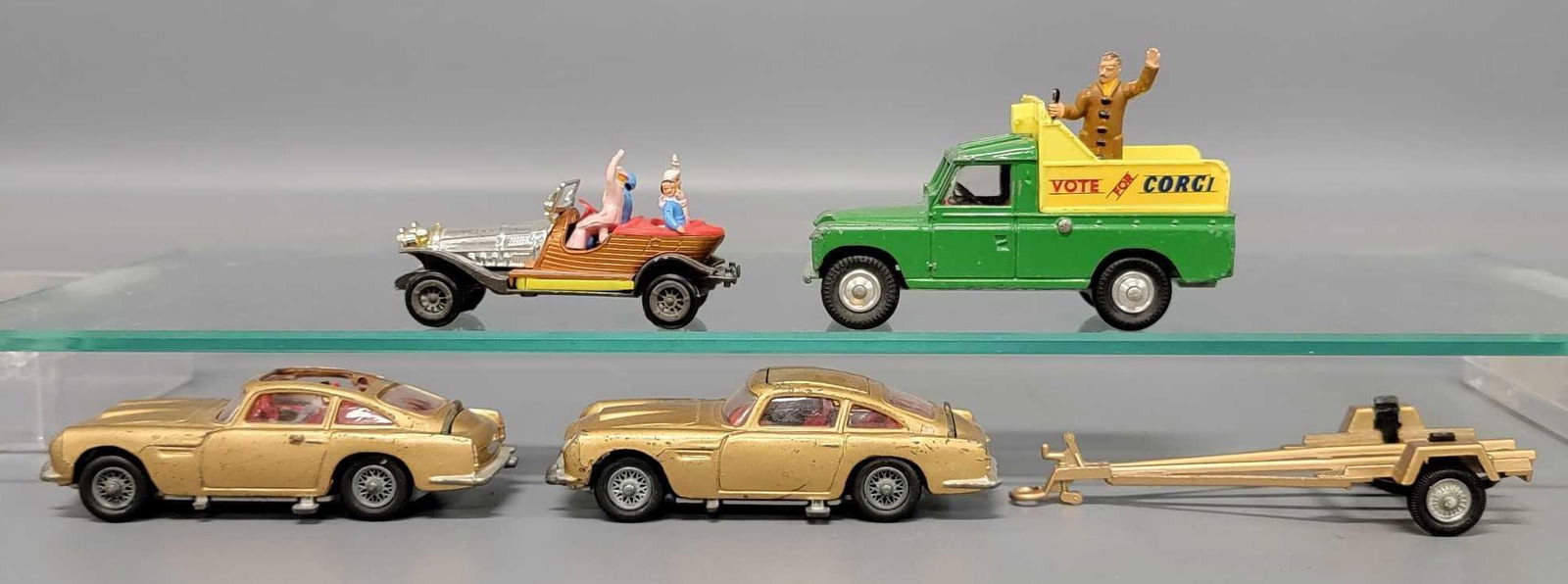 Group Of Corgi Toys Land Rover, Aston Martin, Boat Trailer And Chitty ...