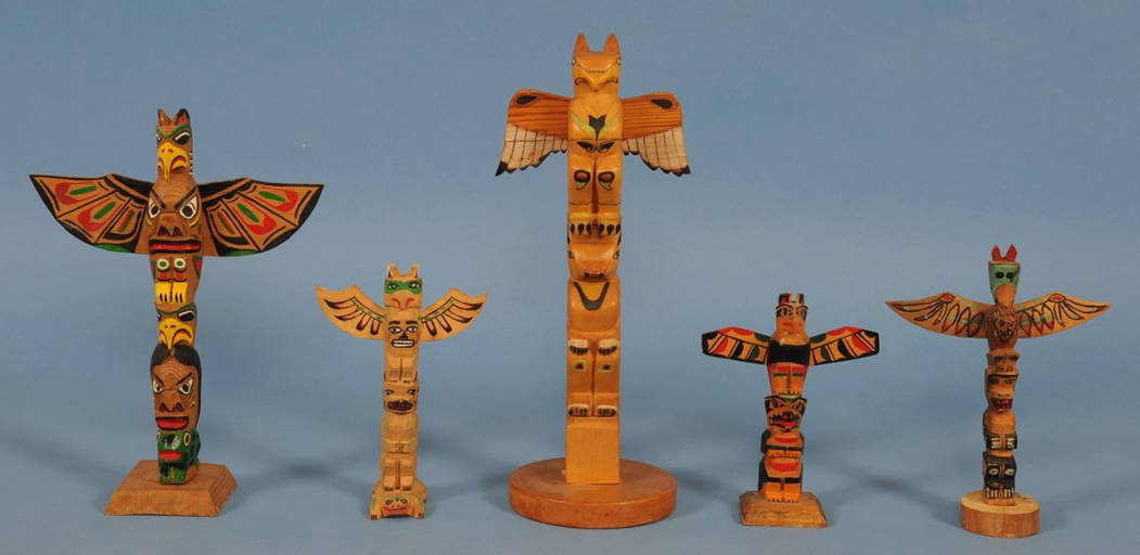 Five Carved And Painted Totems 6 1/2" 12 1/2" H.