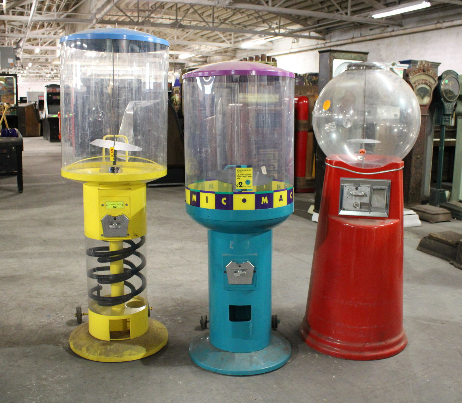 Three Oversized Floor Gumball Machines