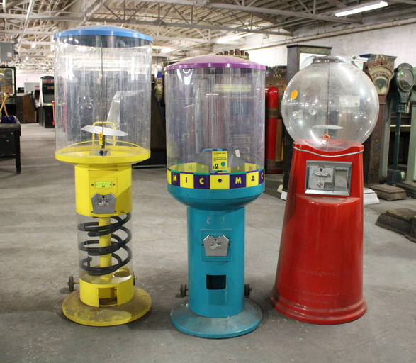 Three Oversized Floor Gumball Machines