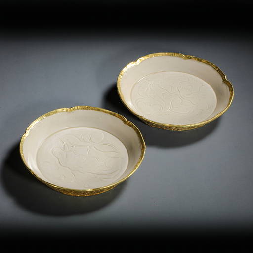 A Pair Of White Porcelain Plates With Floral Designs From The Northern ...