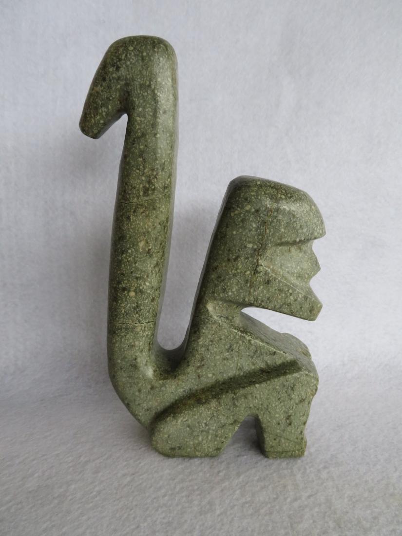 Carved green argillite stone stylized figure, probably