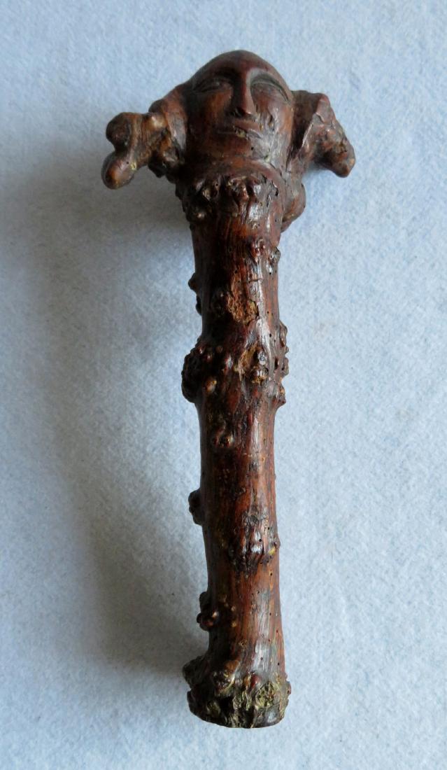 Native American burlwood root club having a hand carved