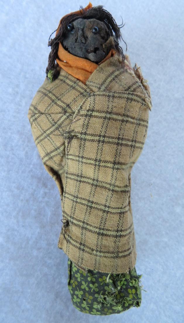 A rare Native American folk art squaw apple head doll
