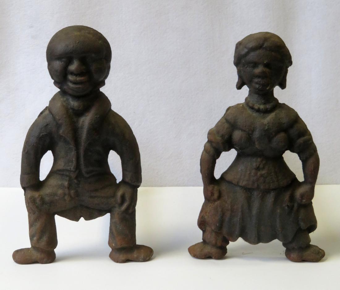 Pair Of Cast Iron Slave Andirons In The Form Of An