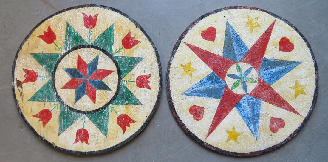 Two hand painted polychrome Pennsylvania hex signs,