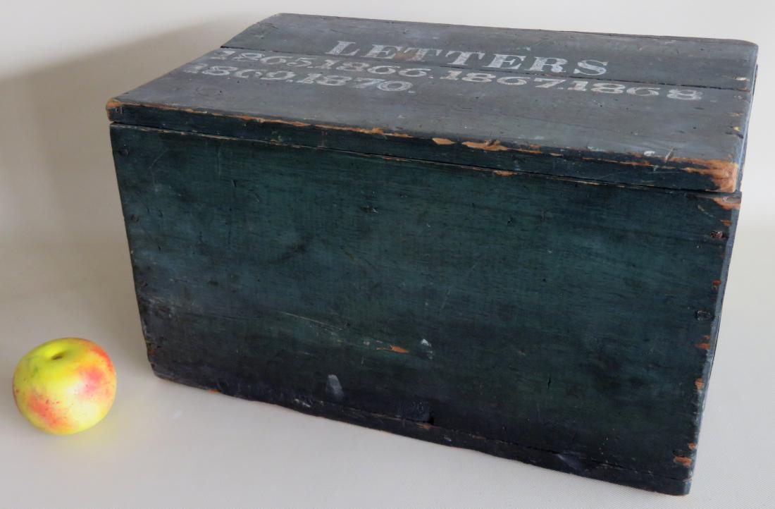 A primitive letter box in original green paint with