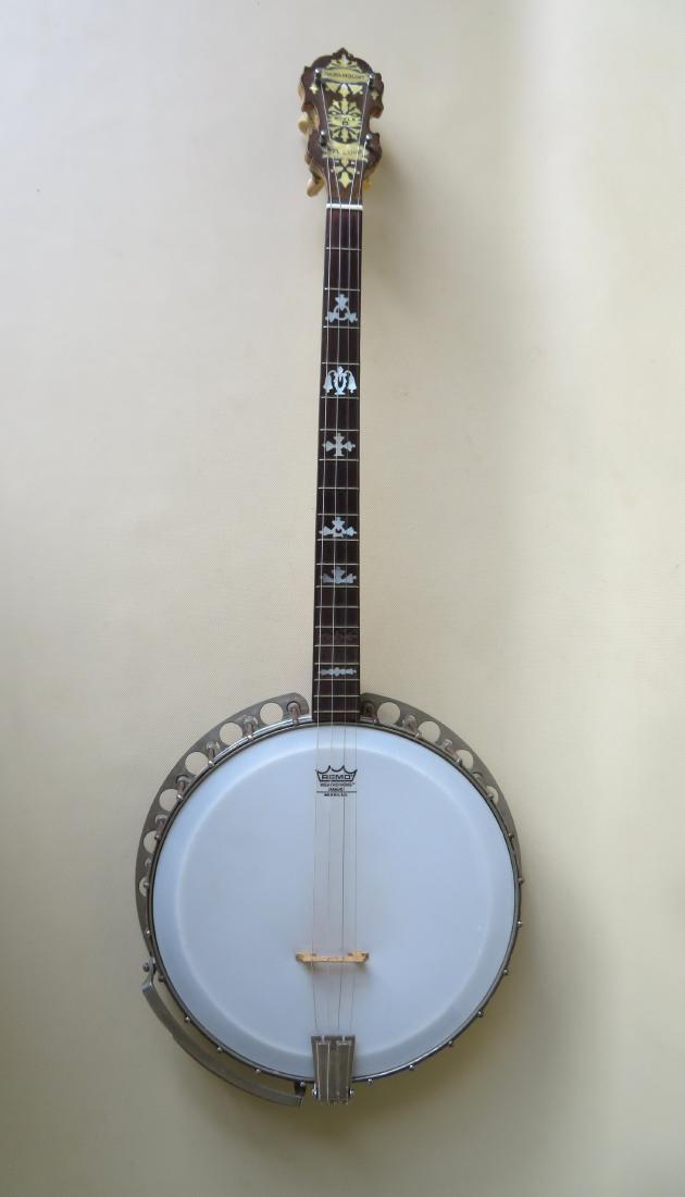 Vintage tenor banjo with mother of pearl inlay on