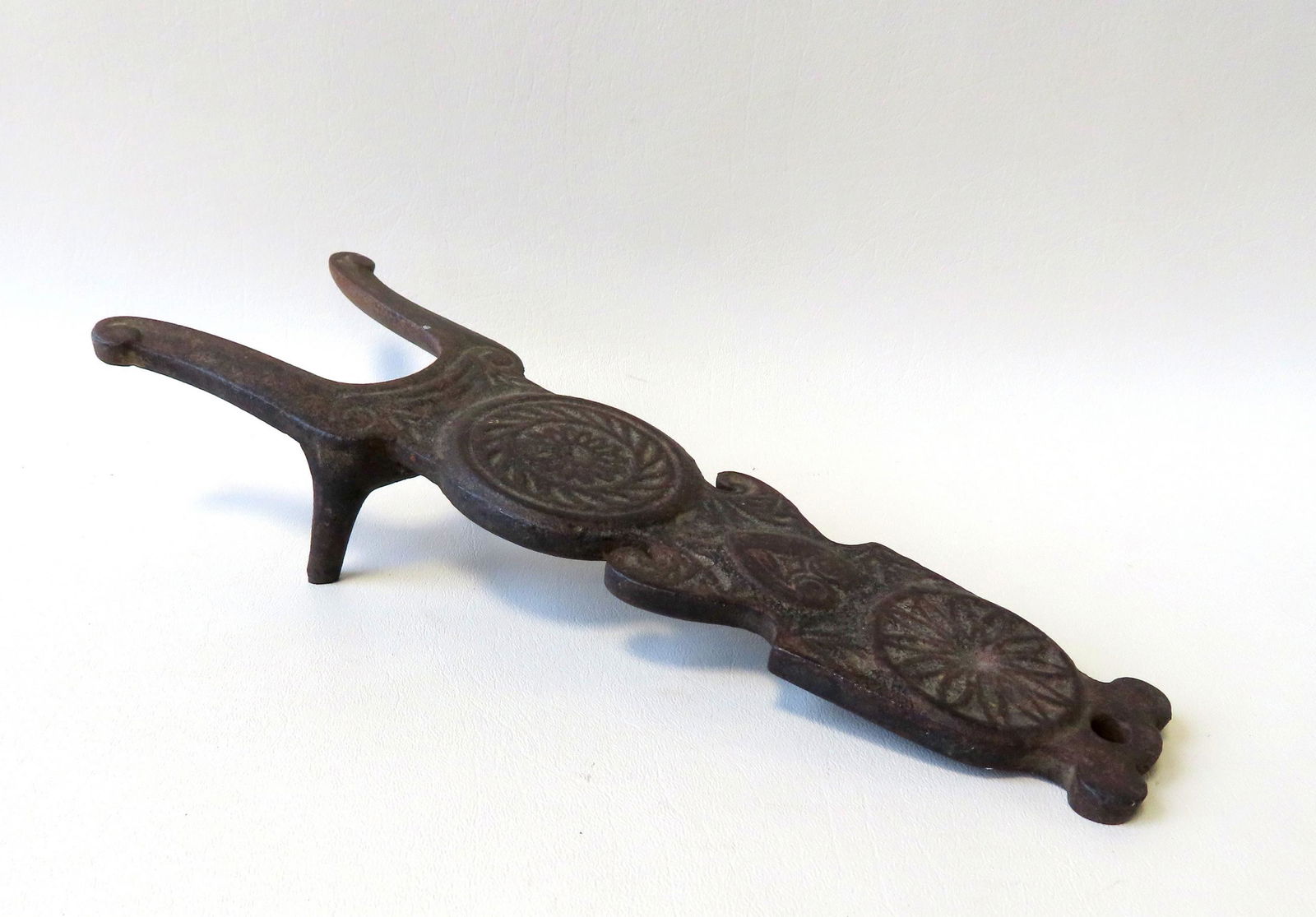 Early Cast Iron Boot Jack Decorated With Embossed