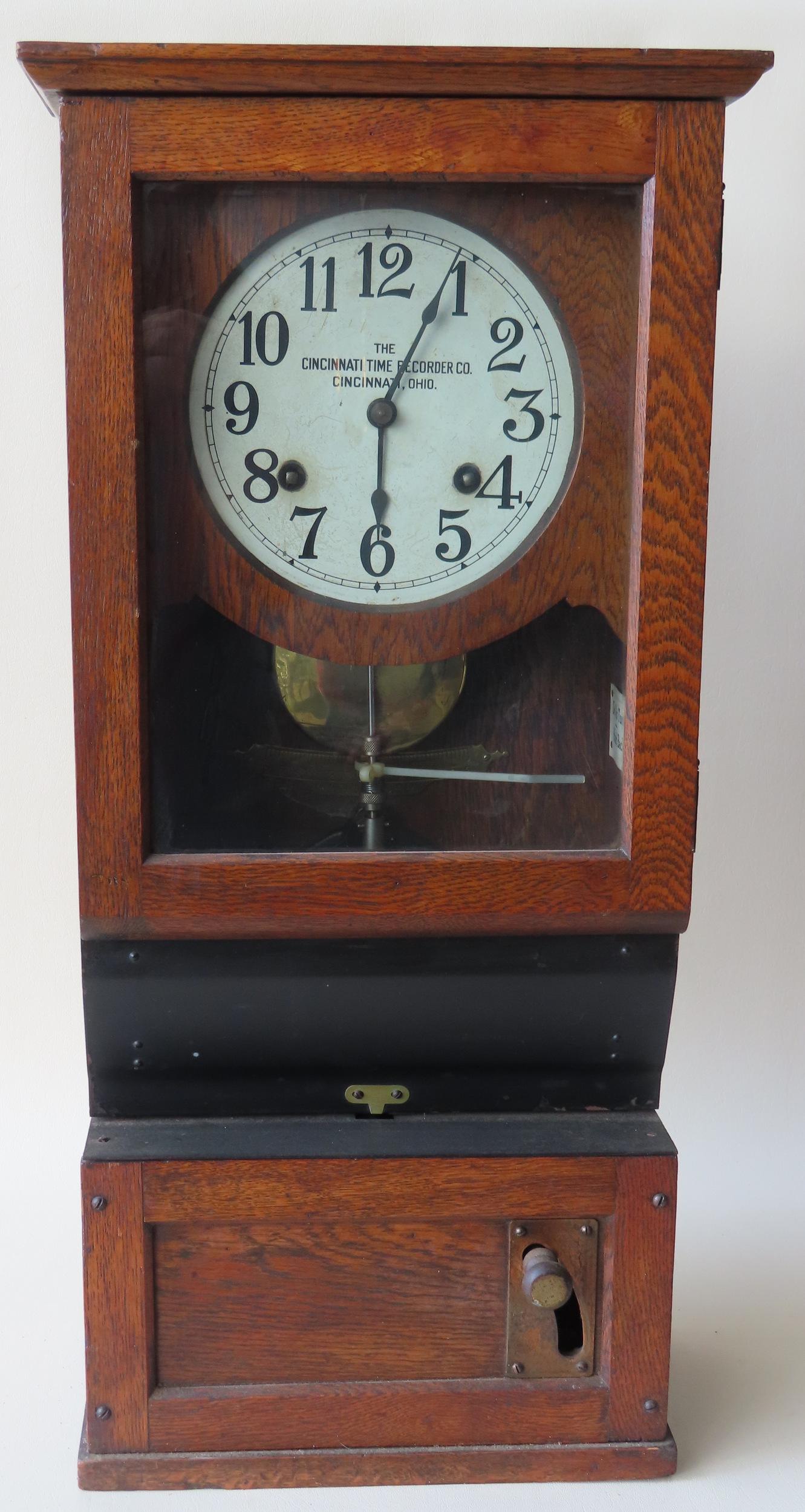 Time recording oak clock marked "The Cincinnati Time | Barnebys