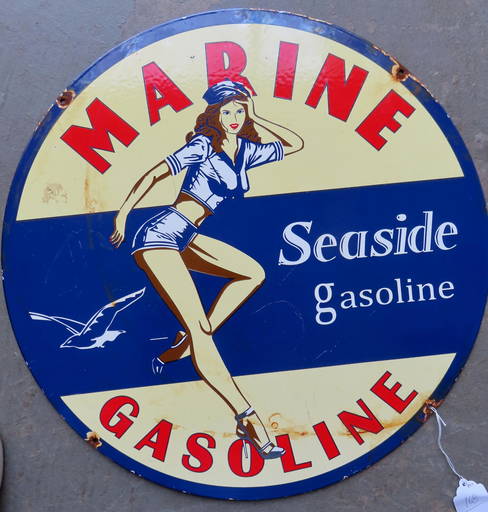 An enameled sheet iron sign marked "Marine Seaside Gasoline" depicting ...