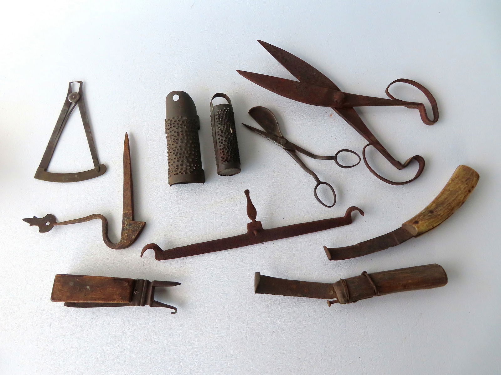 A Grouping Of Small Hand Tools Including: A Metal Measuring Device With ...