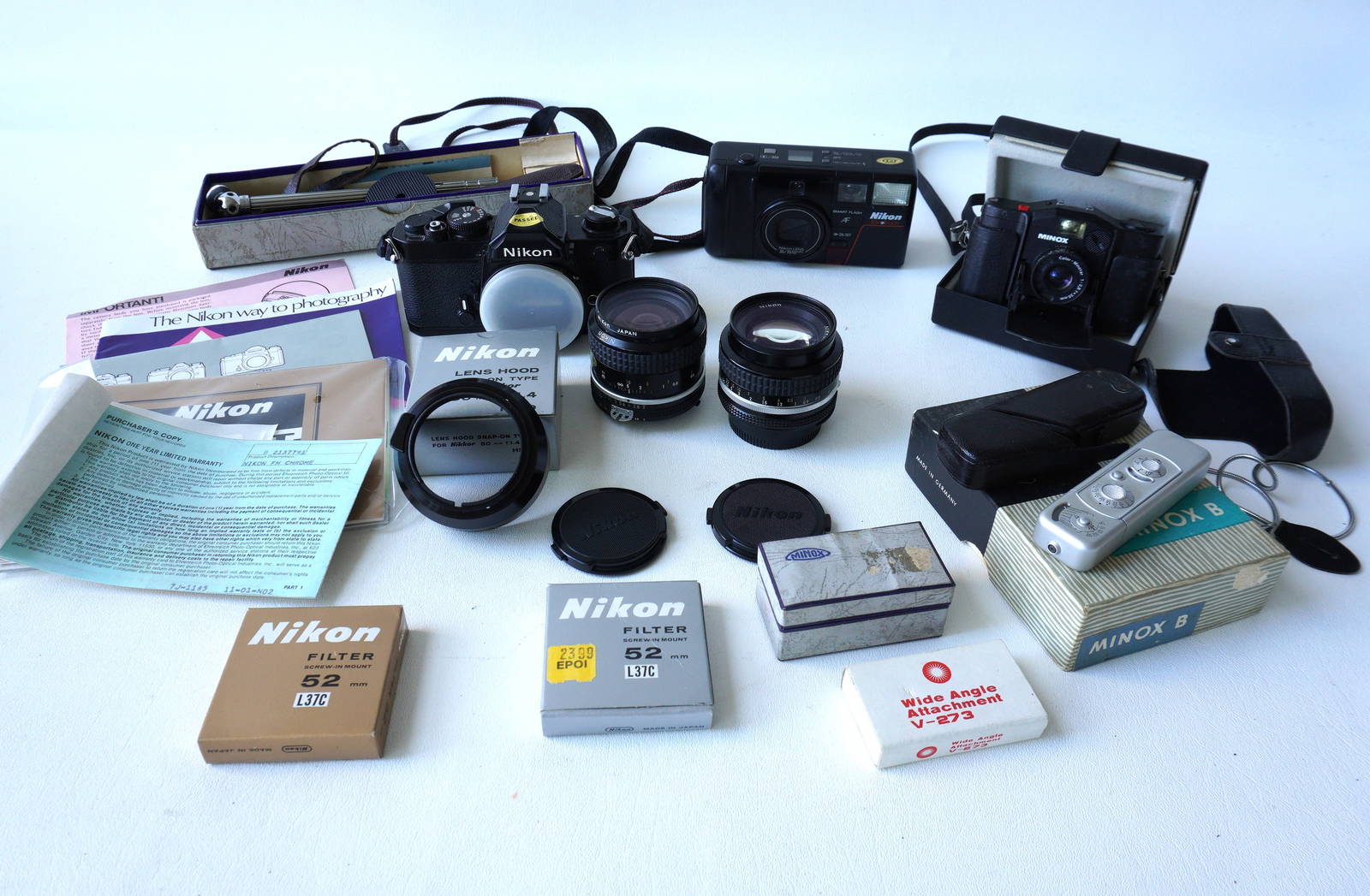 A Grouping Of Nikon And Minox Cameras And Accessories Including Nikon ...