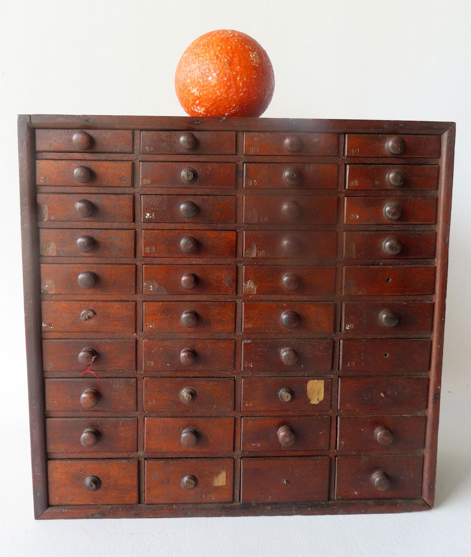 A 40 Drawer Walnut Table Top Storage Unit Having 10 Rows Of 4 Small ...