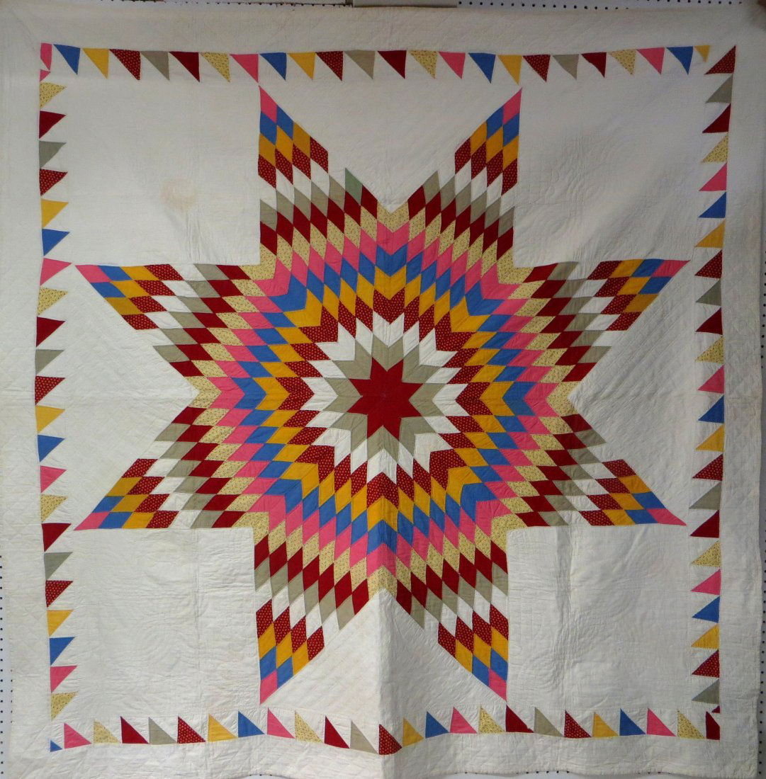 Patchwork quilt in the Texas star pattern with saw toot
