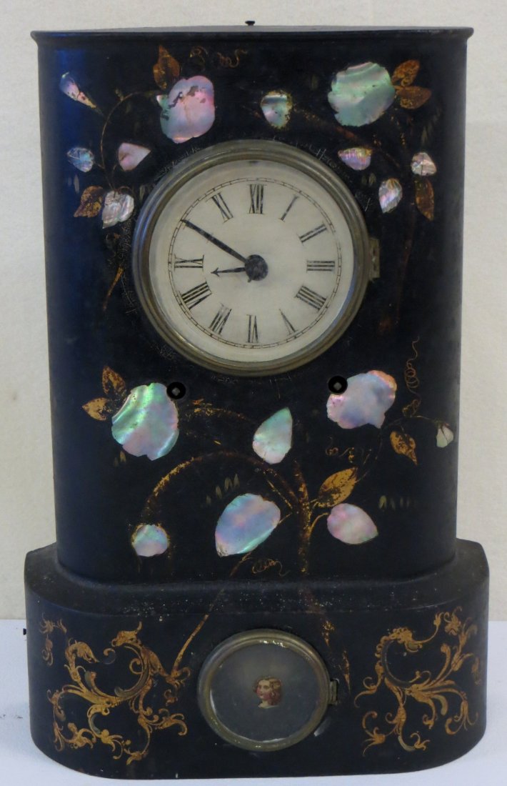 Cast iron Victorian mantle clock with mother-of-pearl