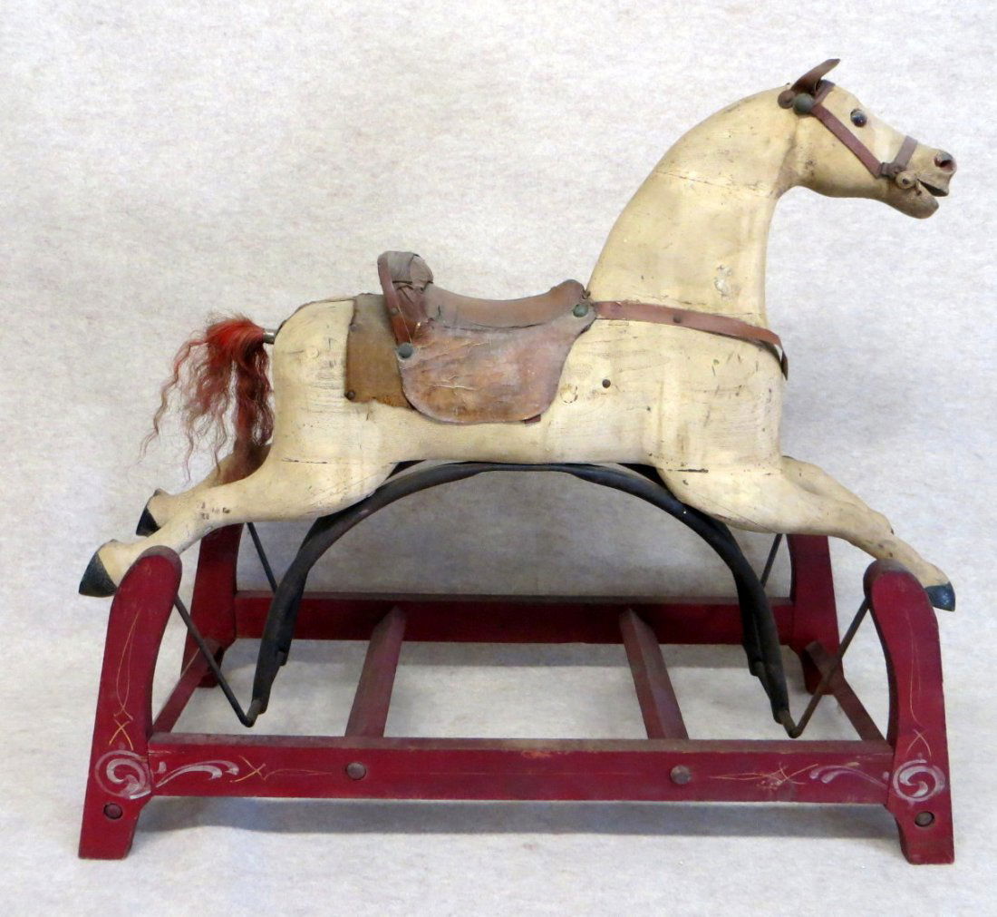Early carved wooden rocking horse on stand - horse in