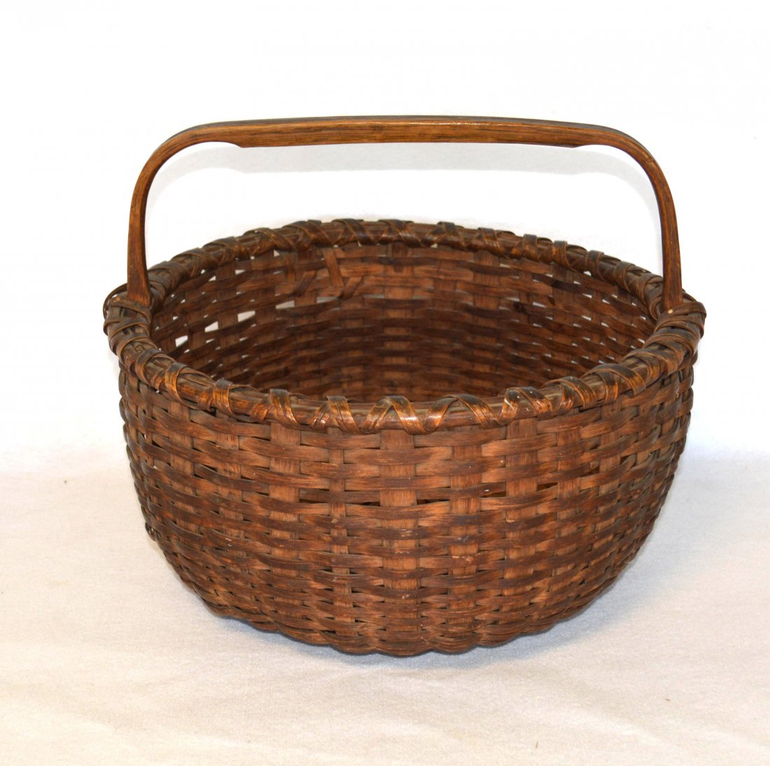 Taghkanic basket with single handle, rounded top,