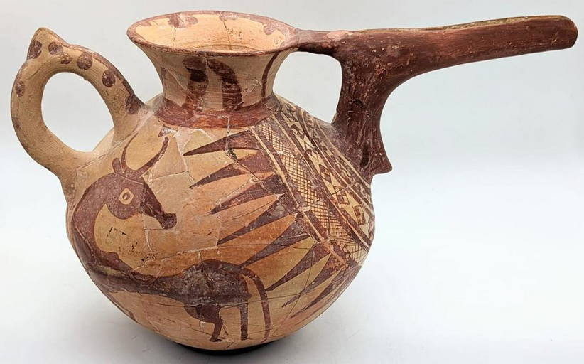 A rare ancient Persian Amlash pouring vessel with long spout, red ...
