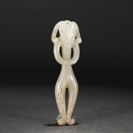 A Chinese Jade Figurine Of Mythical Figure