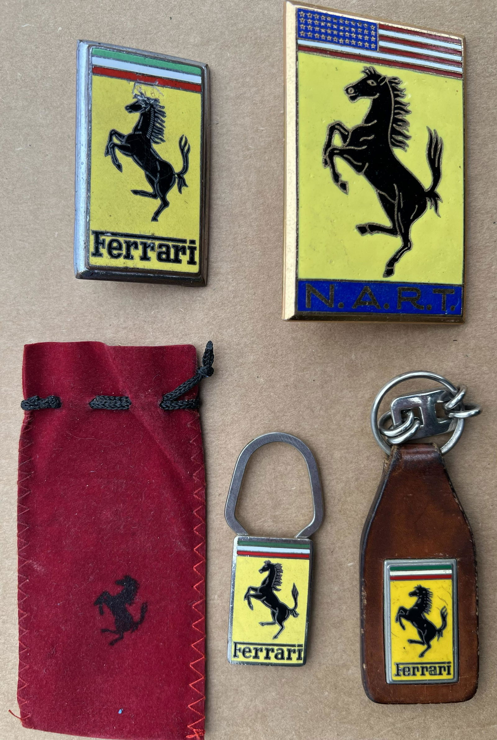 Four period Ferrari items - original badge marked, “M E A Milano,” key ...