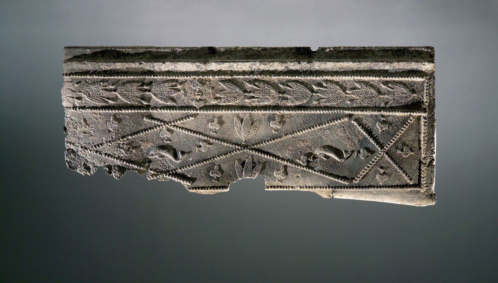 A Fragment Of The Lid Of A Lead Sarcophagus